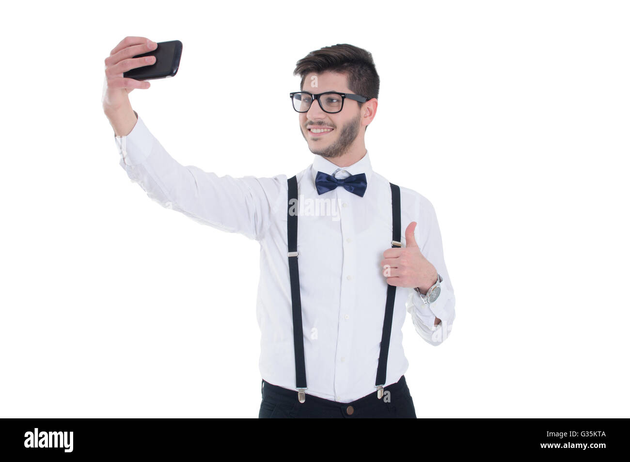 Young man making self-portrait and smiling, isolated on white ...