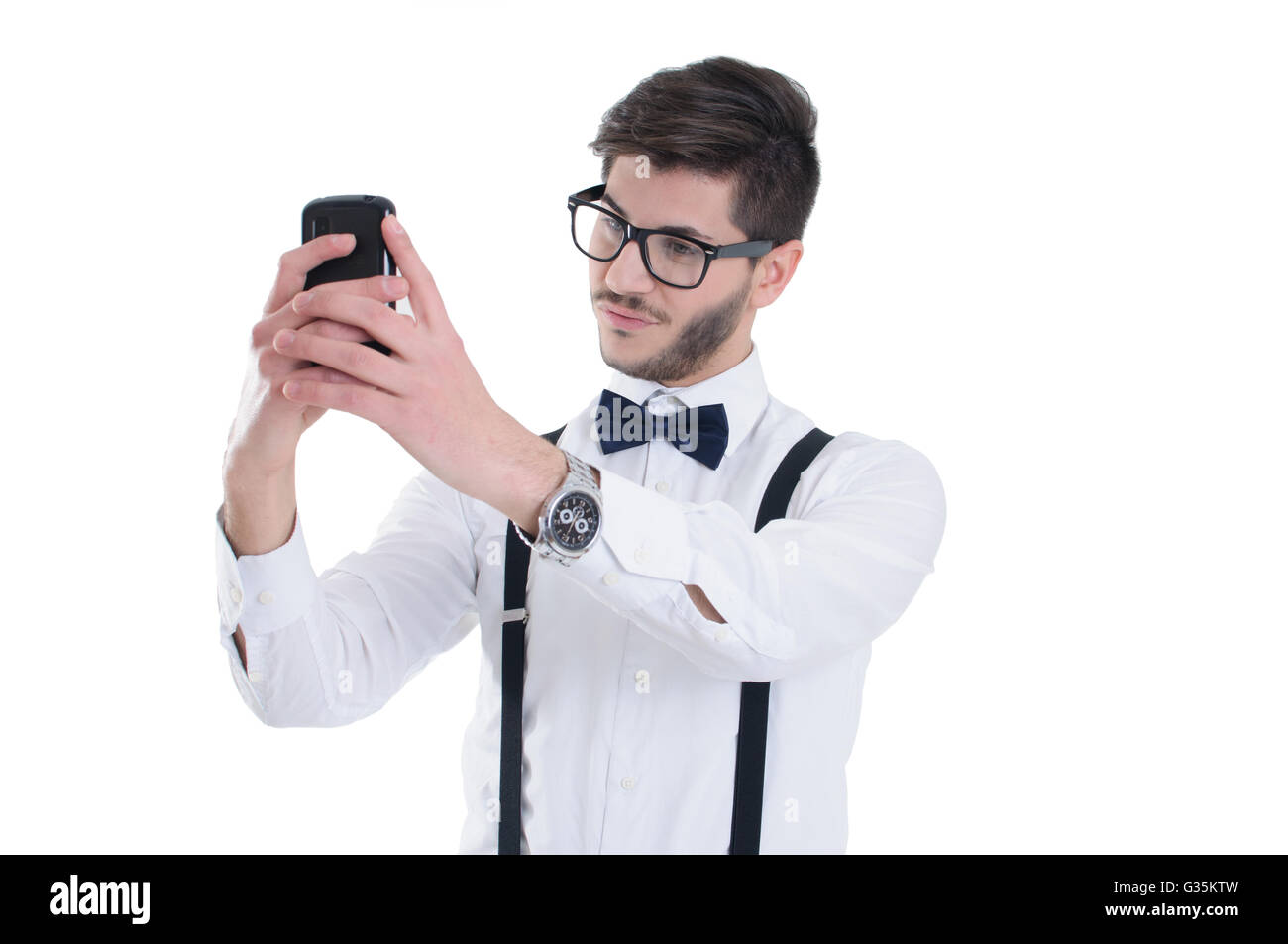 Young man making self-portrait and smiling, isolated on white ...