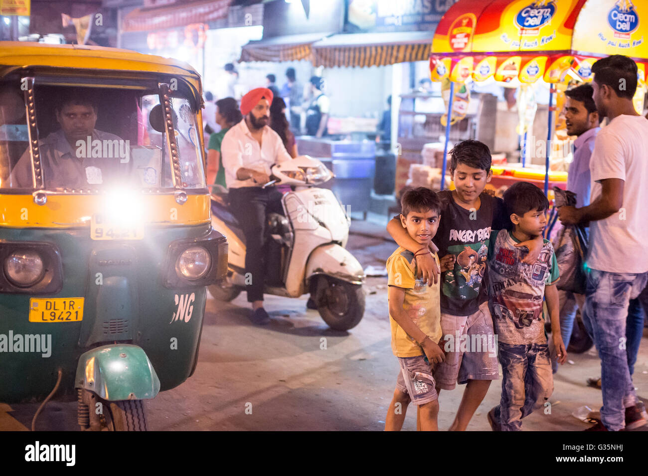 Boys walk with arms around each other in Delhi, India. Credit: Euan ...
