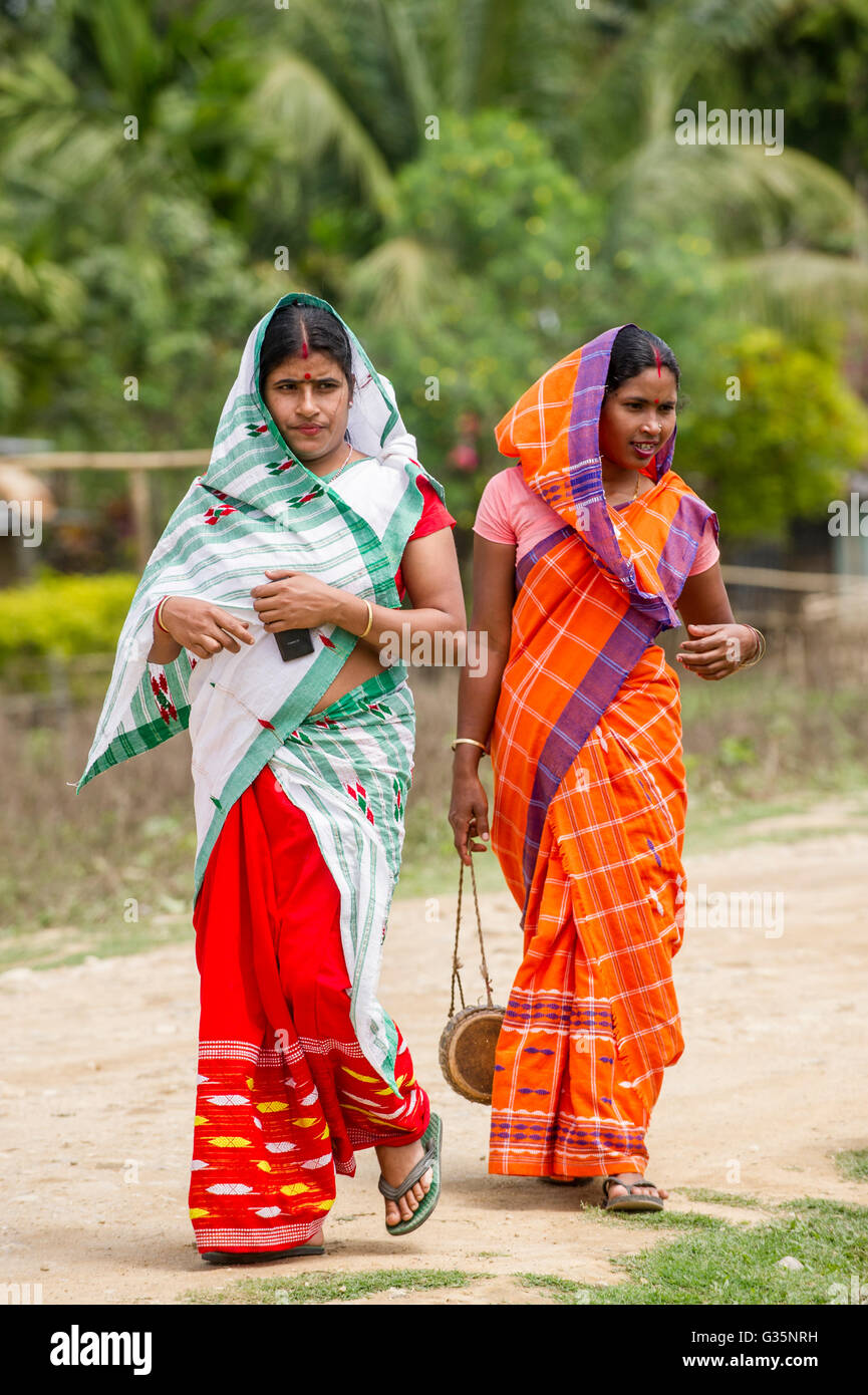 Two women walking in Pan Bari Village in the Kaziranga National Park in ...