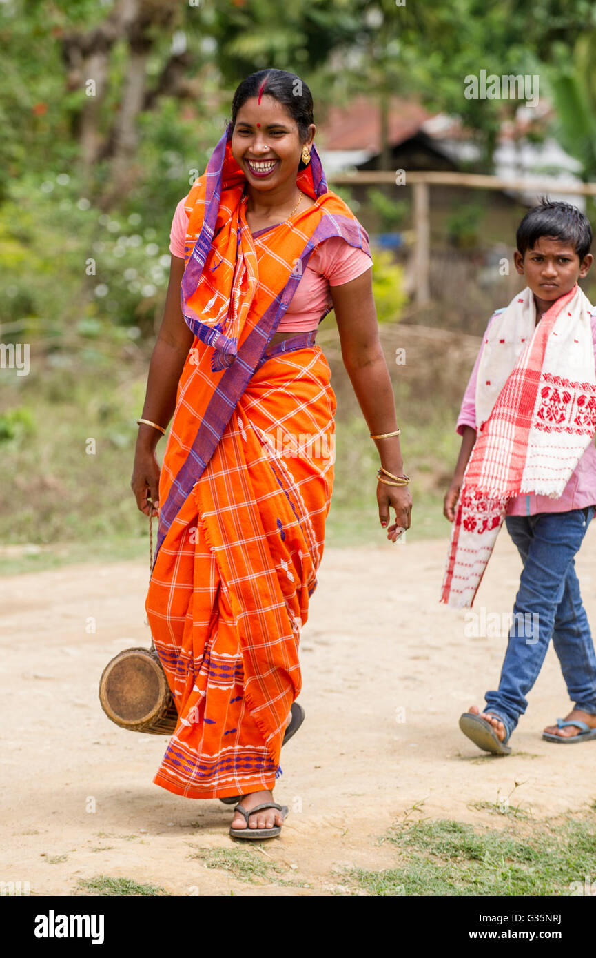 A young women walking in Pan Bari Village in the Kaziranga National ...