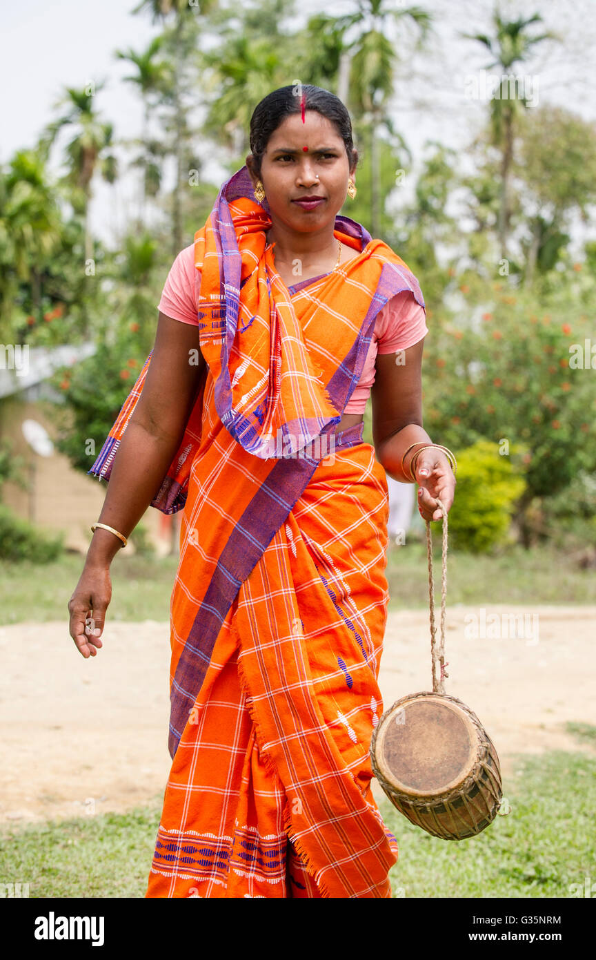 A young walking in Pan Bari Village in the Kaziranga National Park in ...