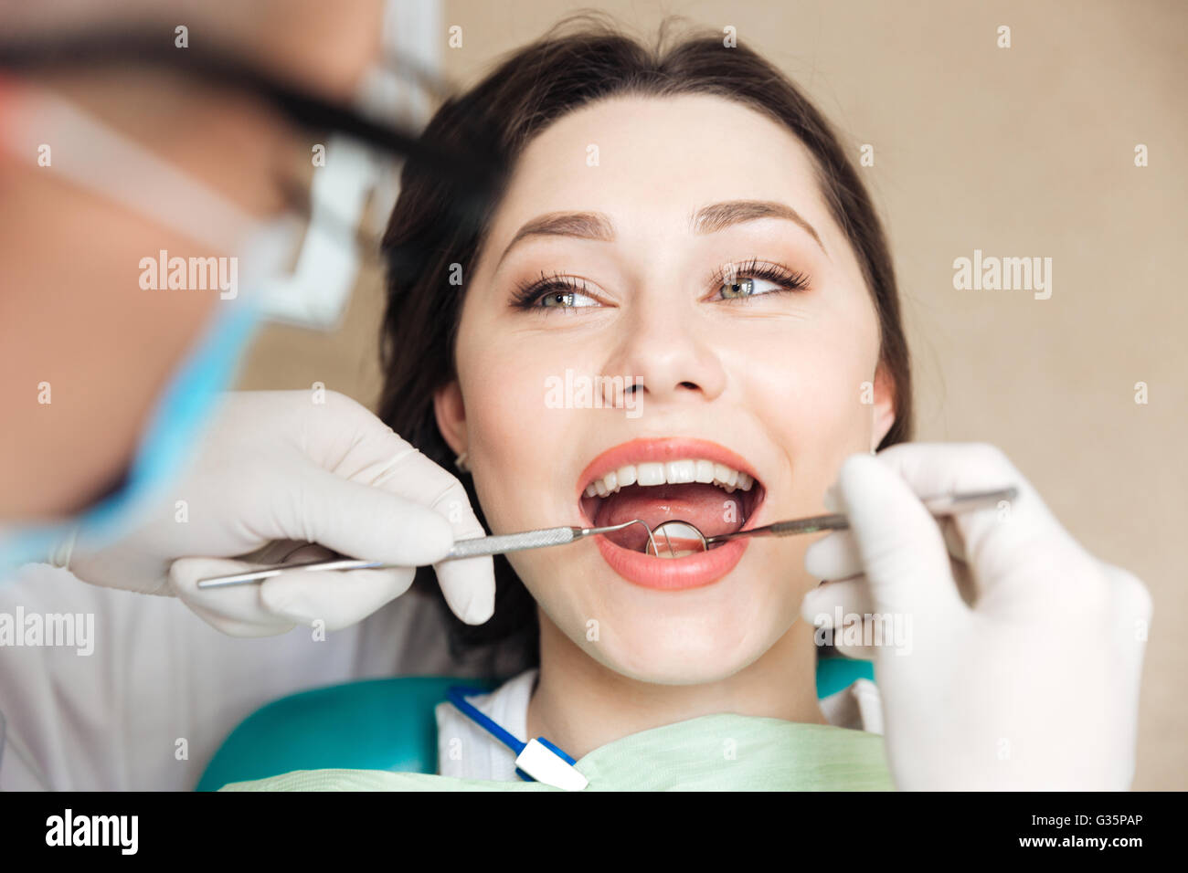 Close-up of a pretty patient with her mouth open in clinic Stock Photo ...