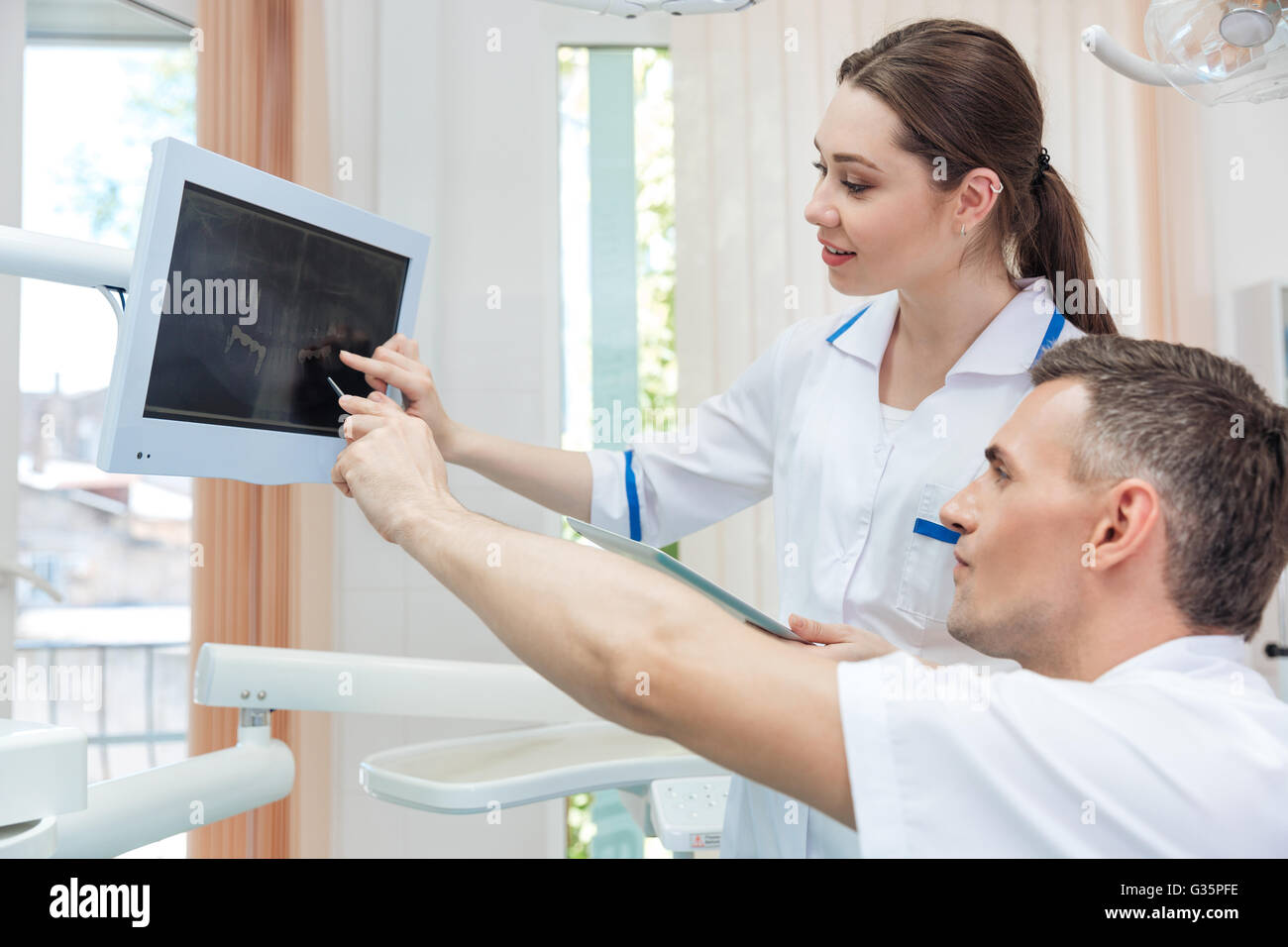 Doctor nurse looking computer monitor hi-res stock photography and ...