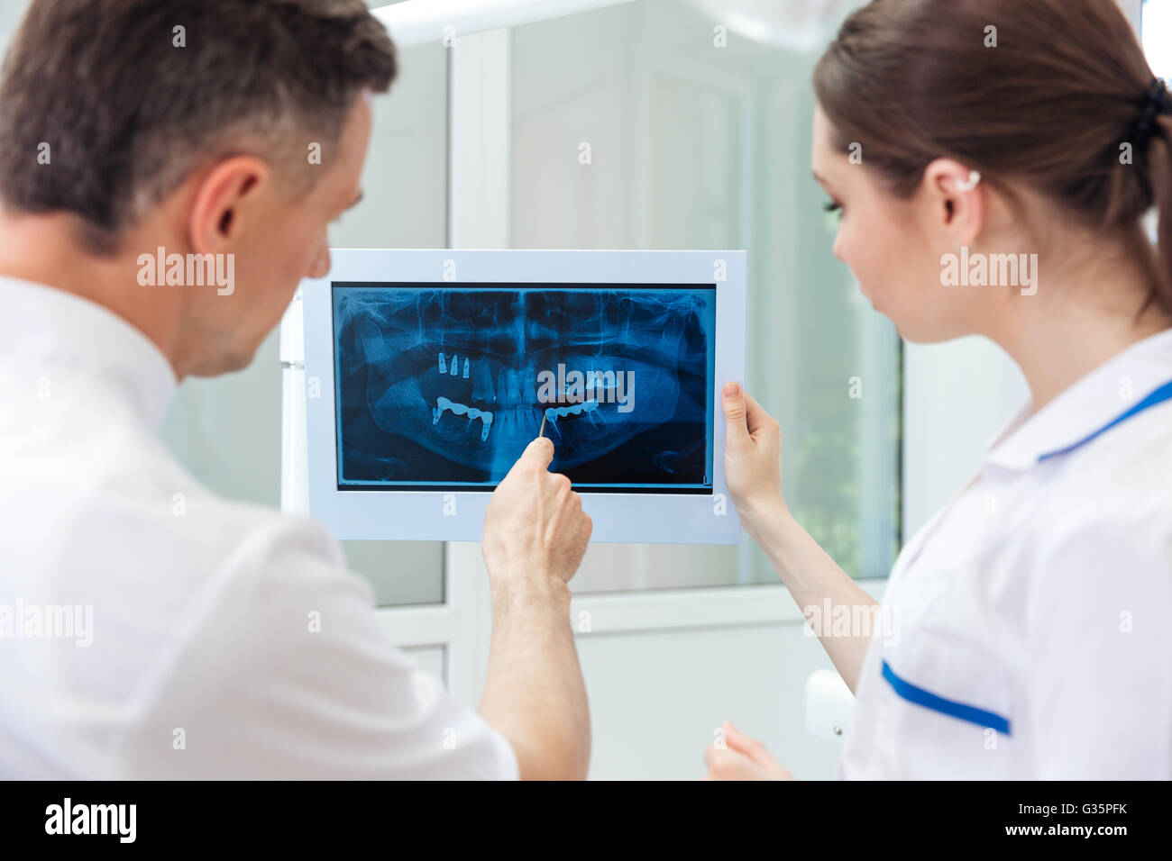 Doctor nurse looking computer monitor hi-res stock photography and ...