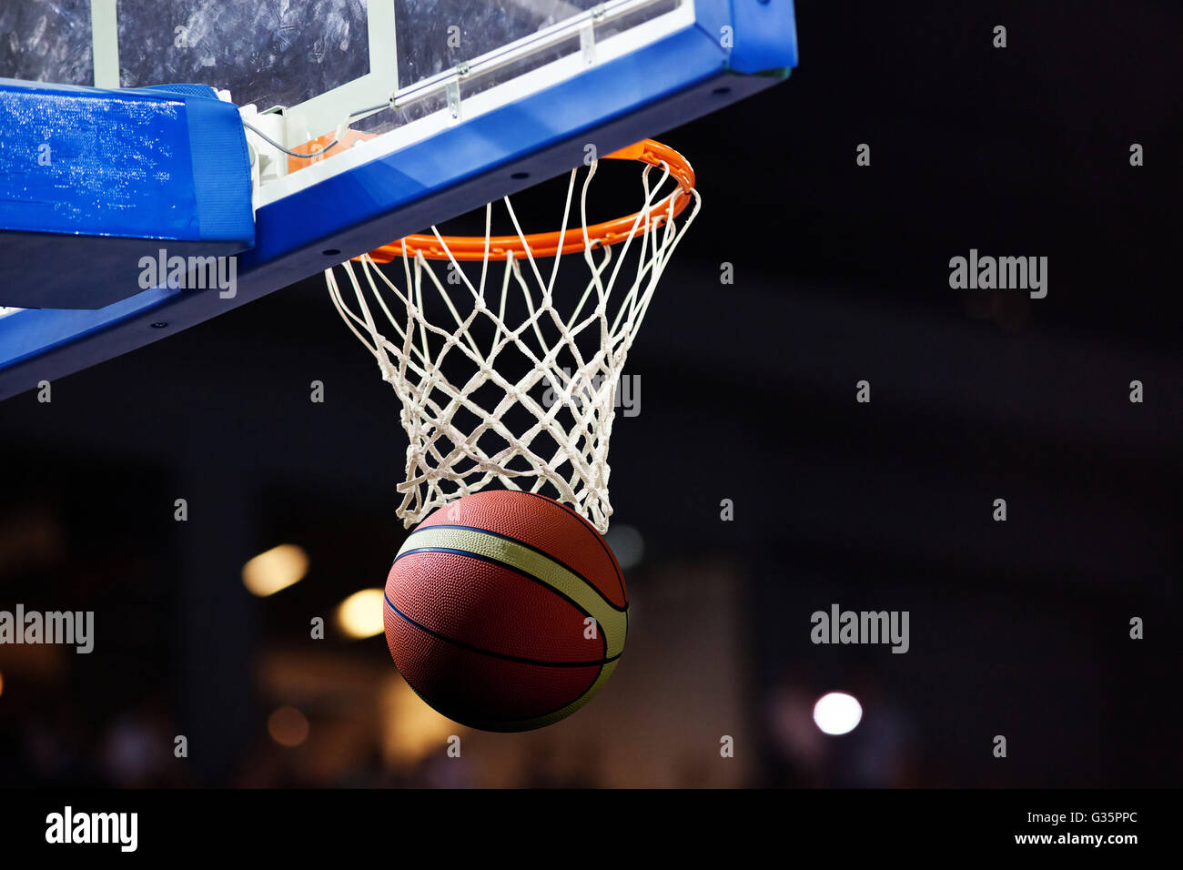 Nba basketball ball through hoop hi-res stock photography and images ...