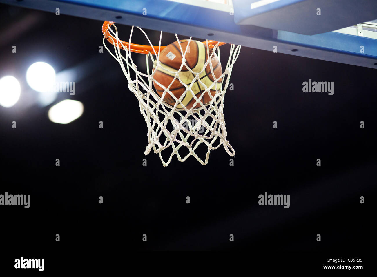 Nba basketball ball through hoop hi-res stock photography and images ...