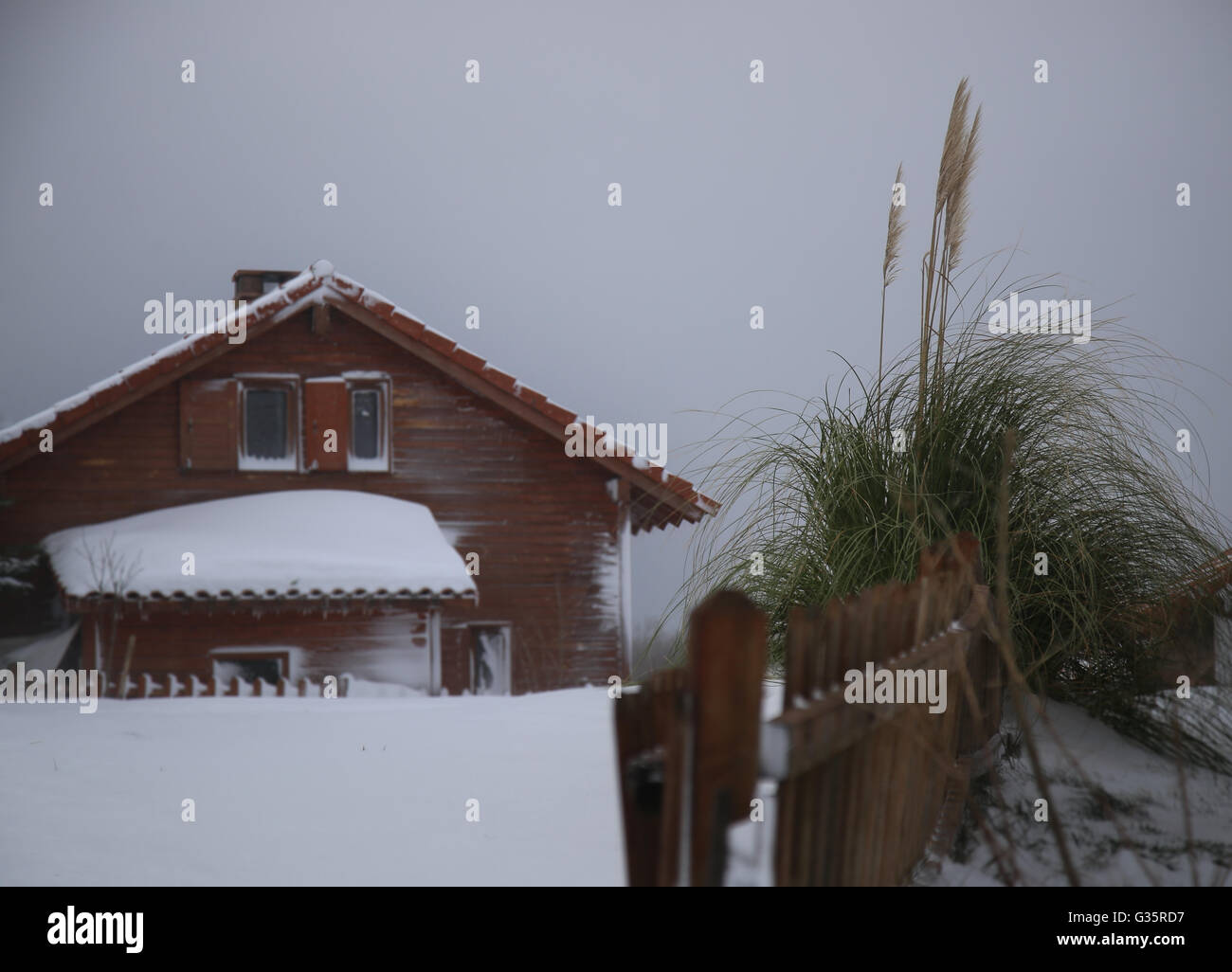 Wooden country house in snow storm Stock Photo - Alamy
