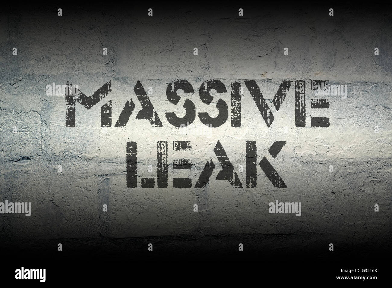 massive leak stencil print on the grunge white brick wall Stock Photo ...