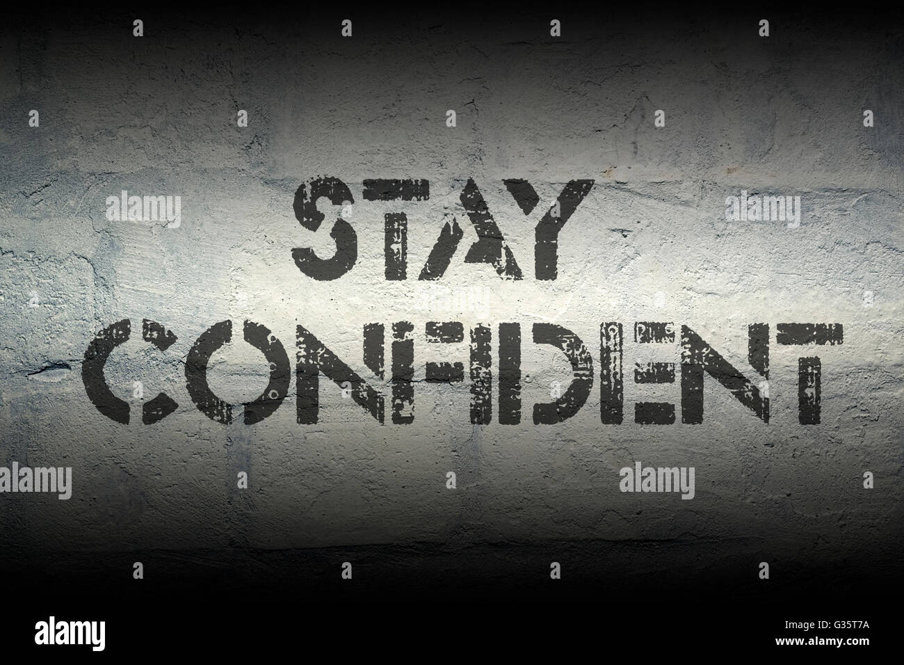 stay confident stencil print on the grunge white brick wall Stock Photo ...