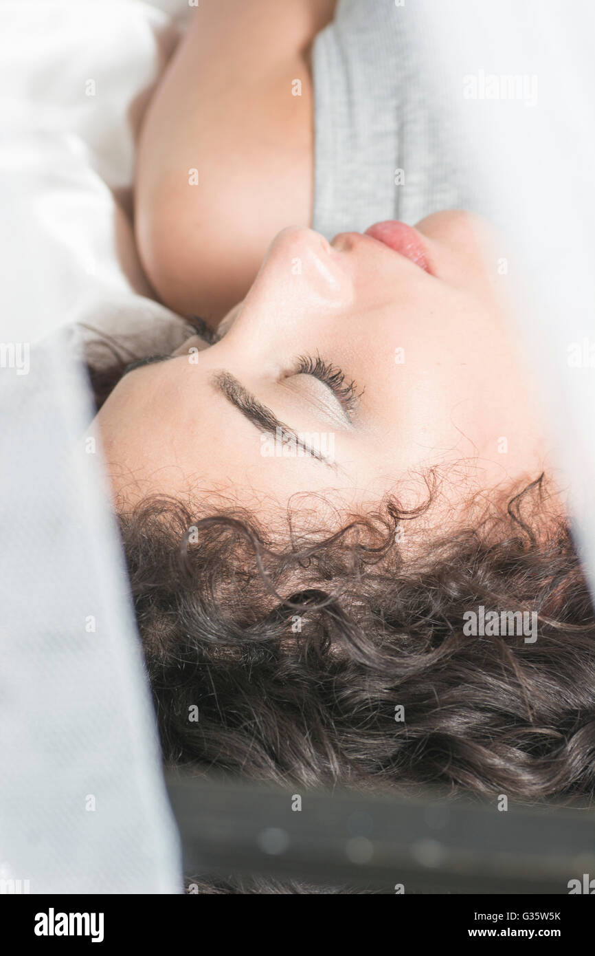 Beautiful young woman in bed Stock Photo - Alamy