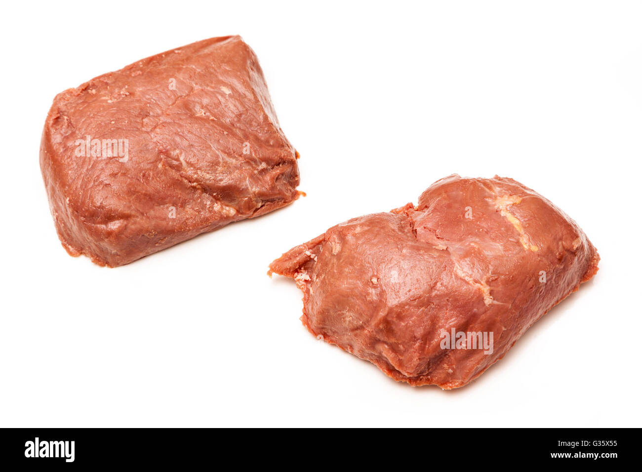 Cooked Ostrich (Struthio camelus) meat steaks isolated on a white ...