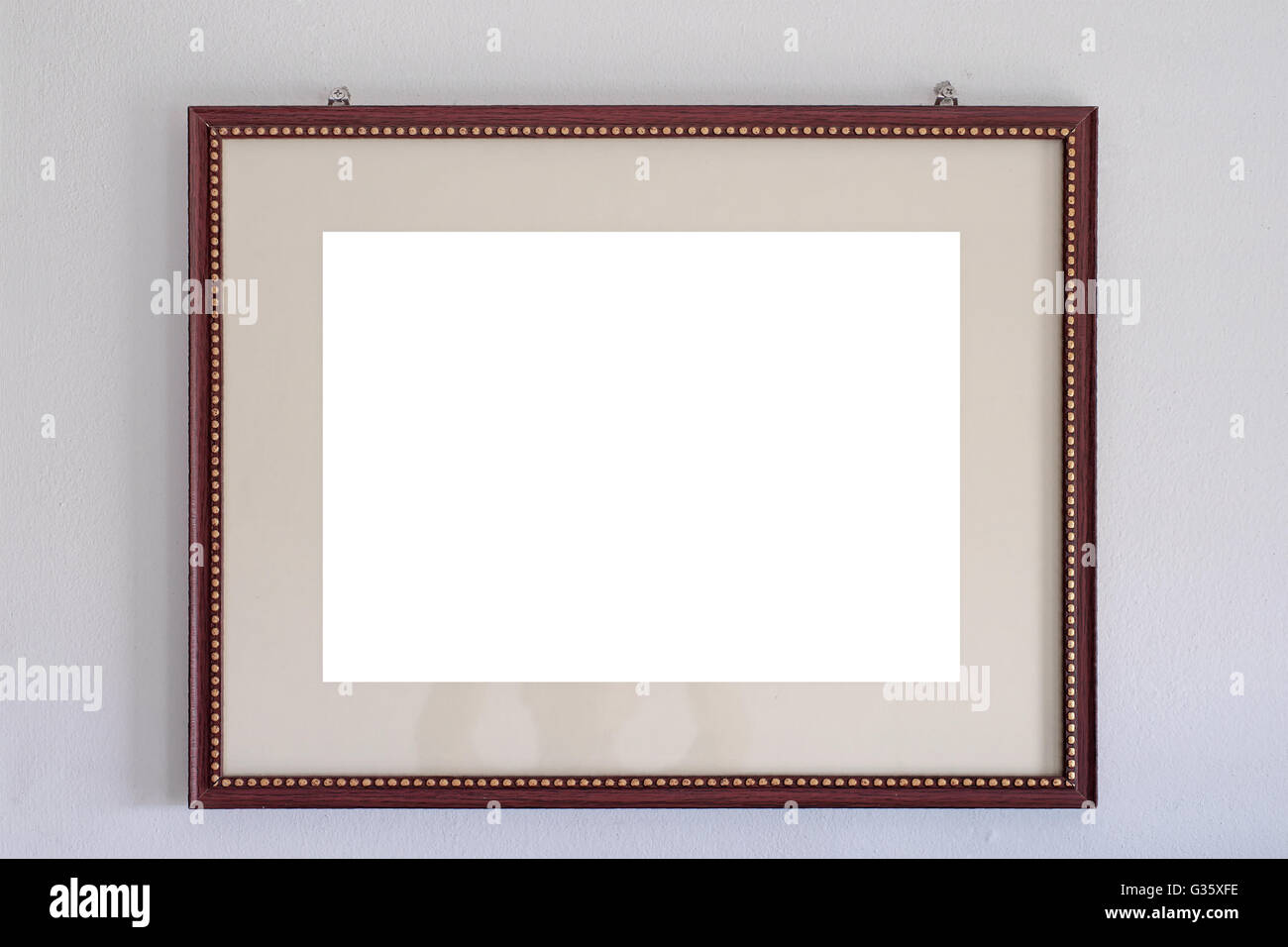 empty wooden picture frames on the cement wall Stock Photo - Alamy