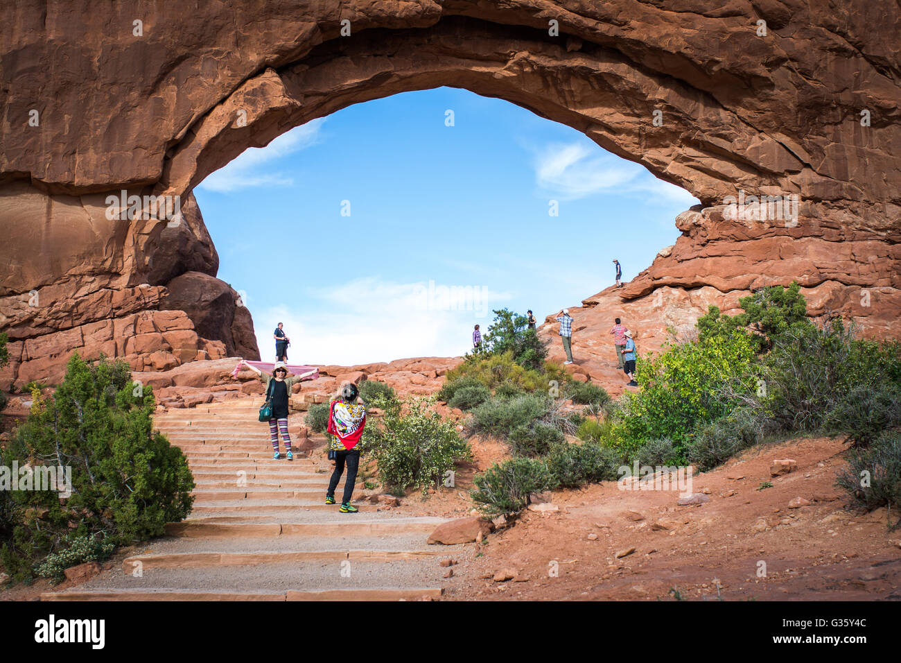 Tourists at North and South Window Arch in Arches National Park, Moab ...
