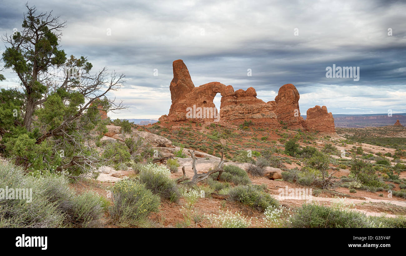 Low-hanging clouds over Turret Arch, in Arches National Park, near Moab ...