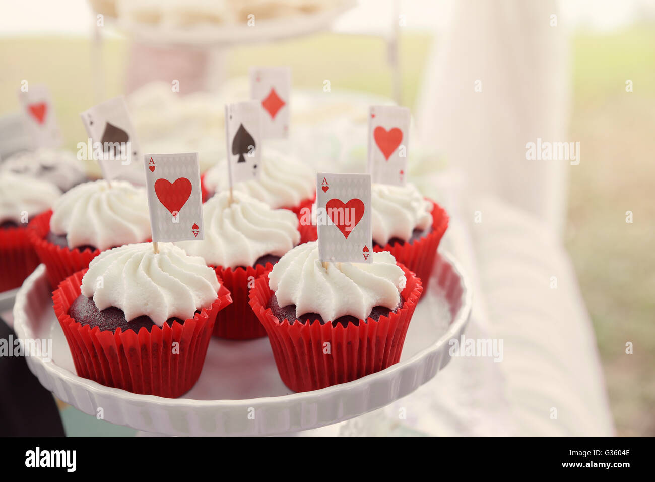 Red velvet cupcakes with playing cards toppers, Alice in wonderland tea ...
