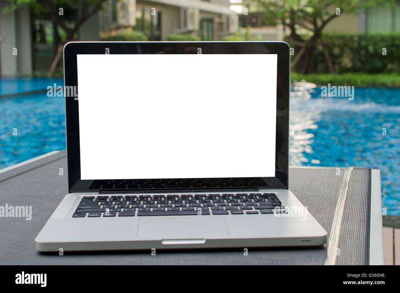 a laptop on the deckchair in swimming pool Stock Photo - Alamy