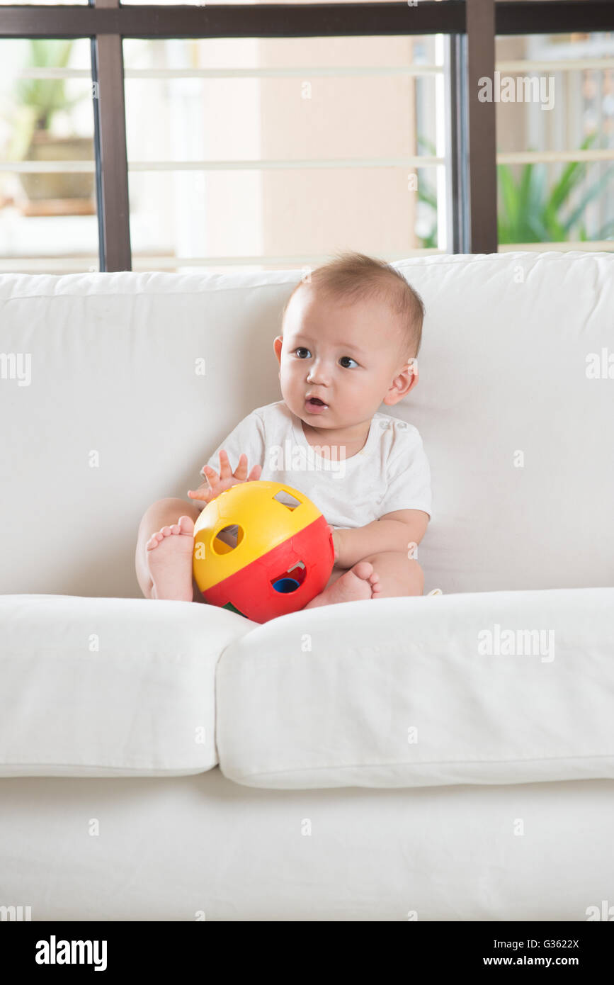 asian baby playing with ball Stock Photo - Alamy