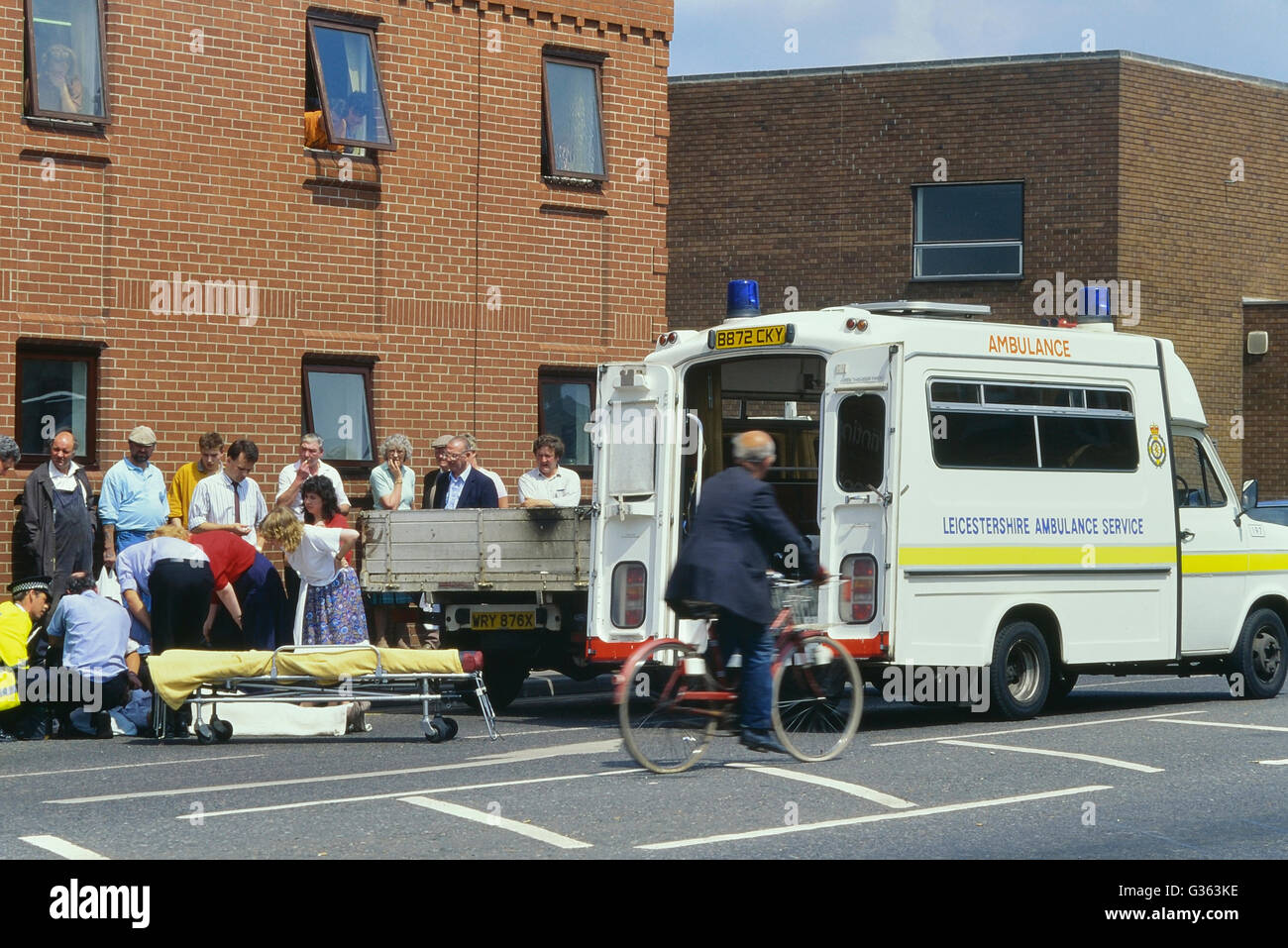 Ambulance crew attend to an accident in Leicester. England. UK. Circa ...