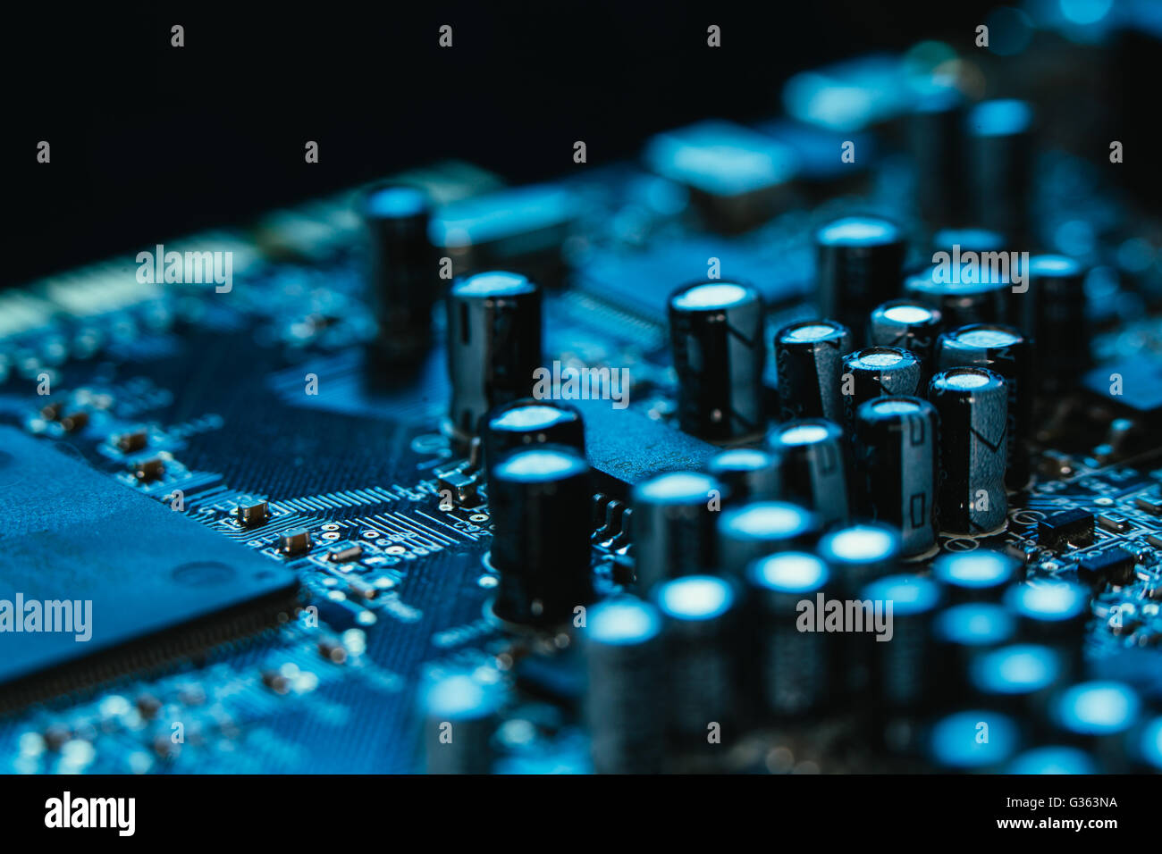 Computer motherboard closeup blue color on dark background Stock Photo ...