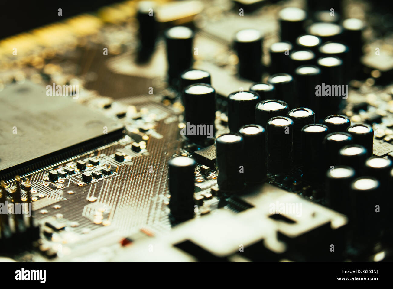 Computer motherboard closeup yellow gray color on dark background Stock ...