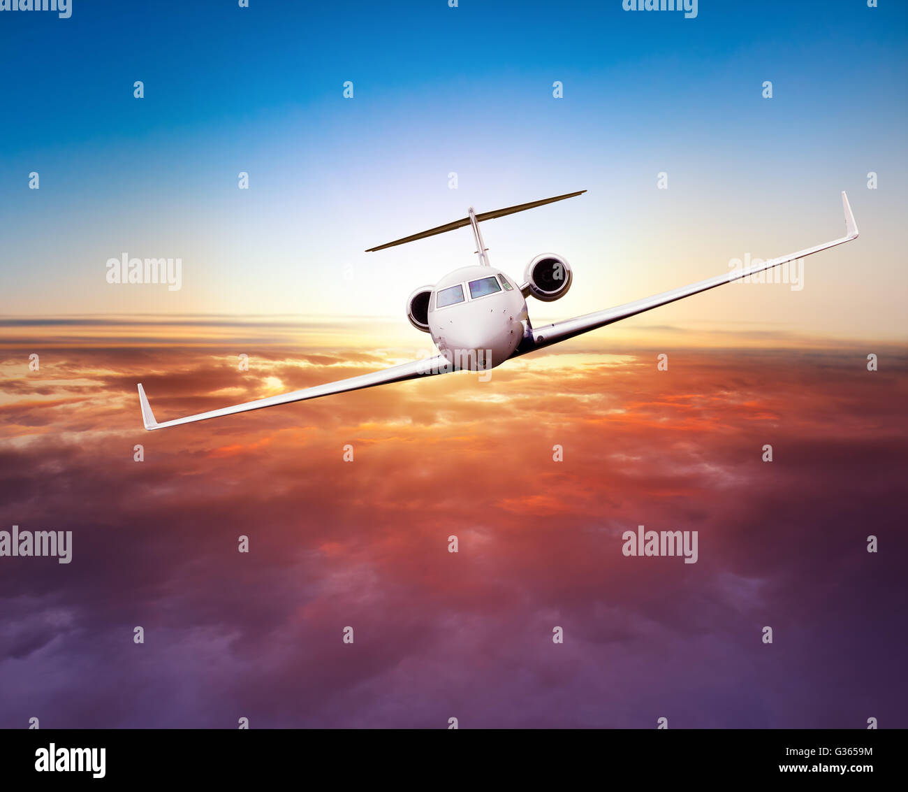Private jet plane flying above clouds in beautiful sunset. Shot from ...