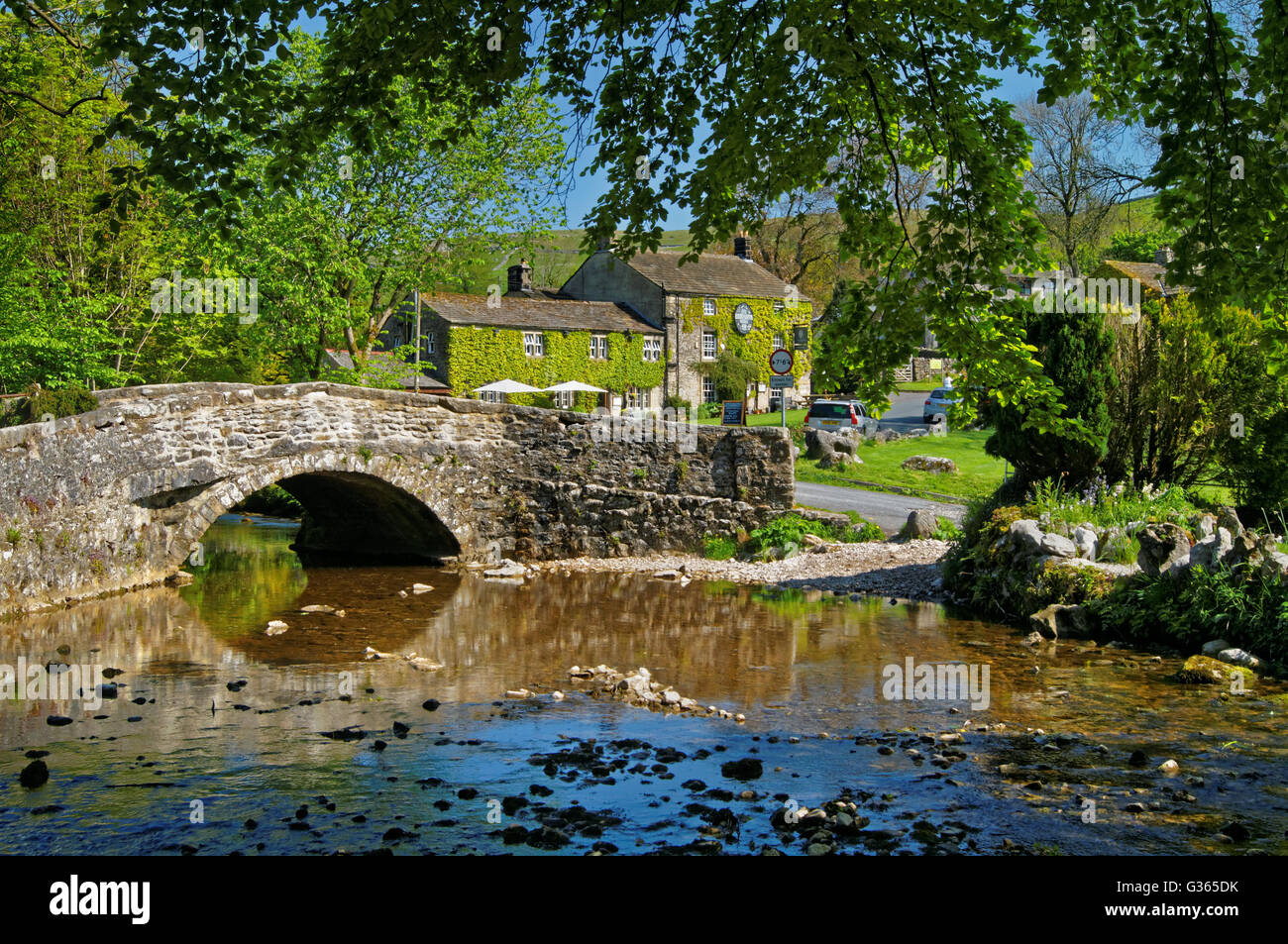 UK, North Yorkshire, Yorkshire Dales, Malham, Bridge over Malham Beck ...