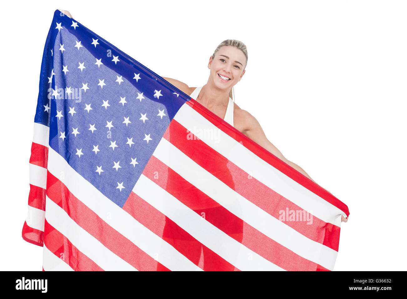 Female athlete holding American flag Stock Photo - Alamy