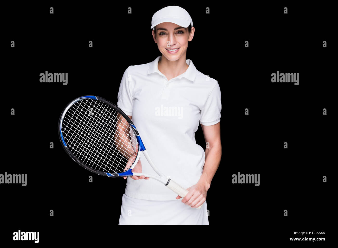 Female athlete posing with tennis racket Stock Photo - Alamy