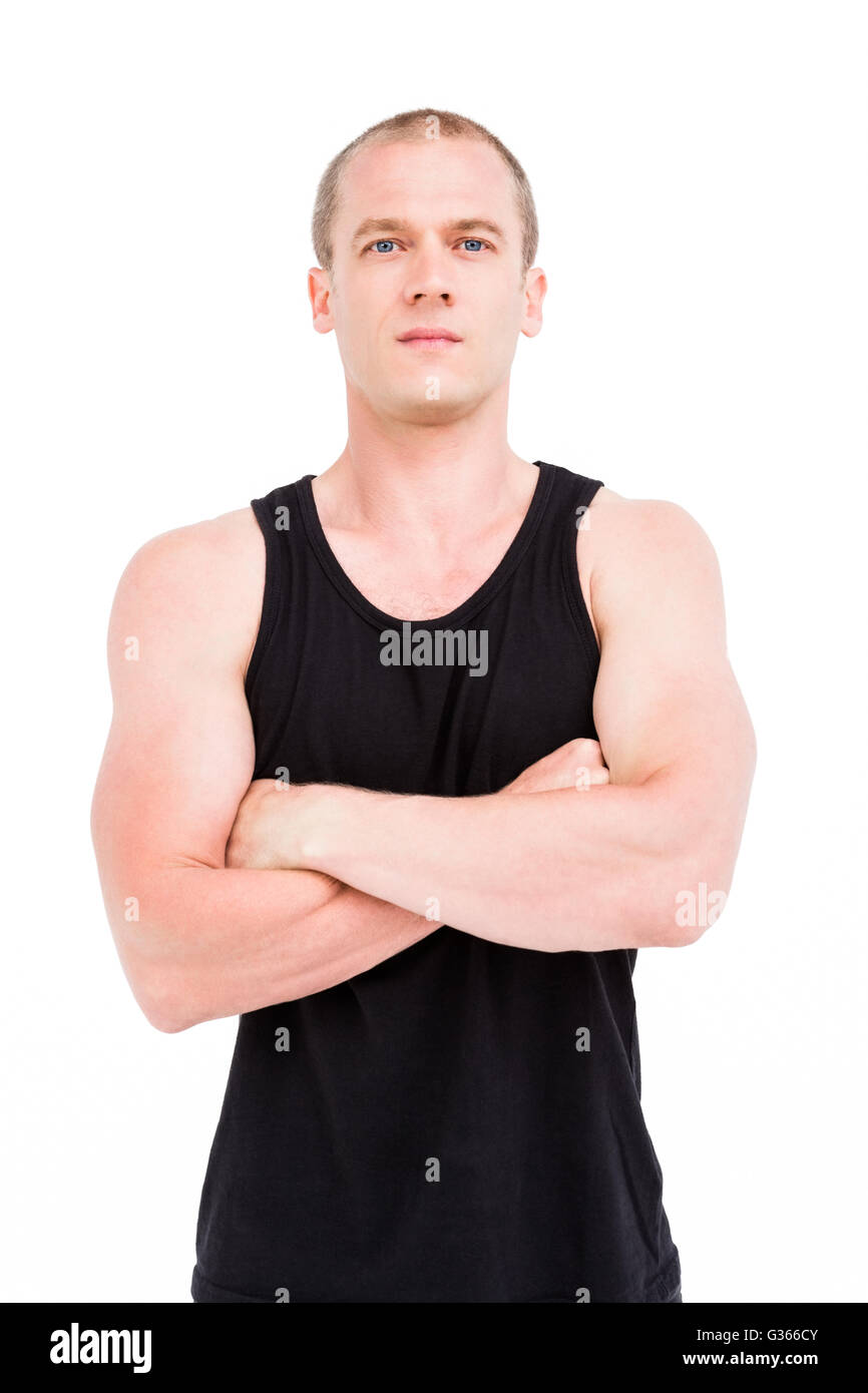 Athlete standing with arms crossed Stock Photo - Alamy