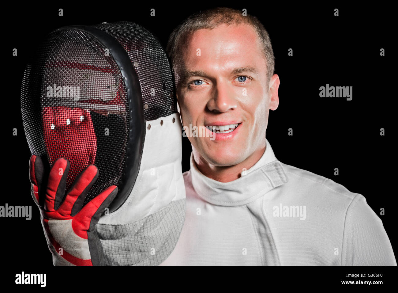 Close-up of swordsman holding fencing mask Stock Photo - Alamy
