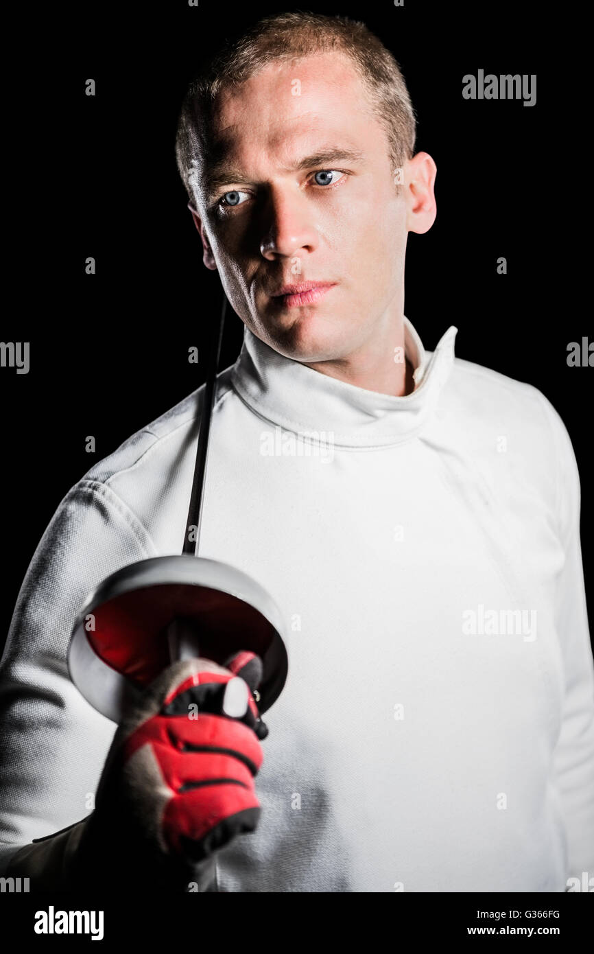 Close-up of swordsman holding fencing sword Stock Photo - Alamy
