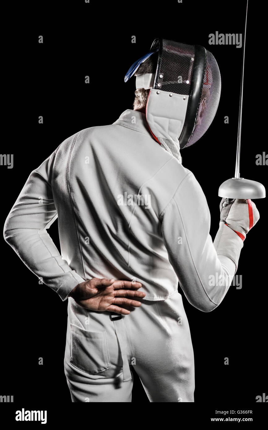 Man wearing fencing suit practicing with sword Stock Photo - Alamy