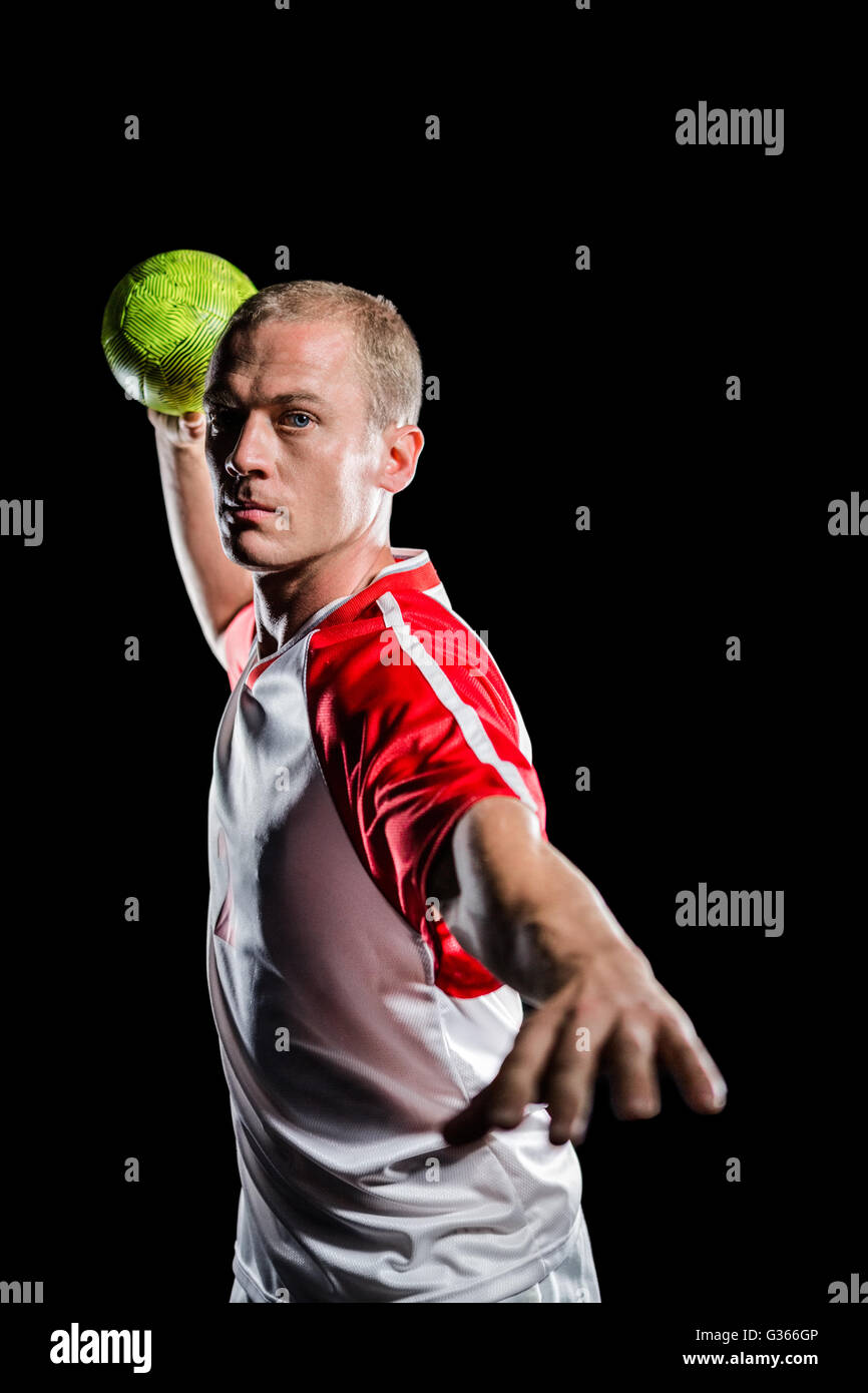 Sportsman throwing a ball Stock Photo - Alamy