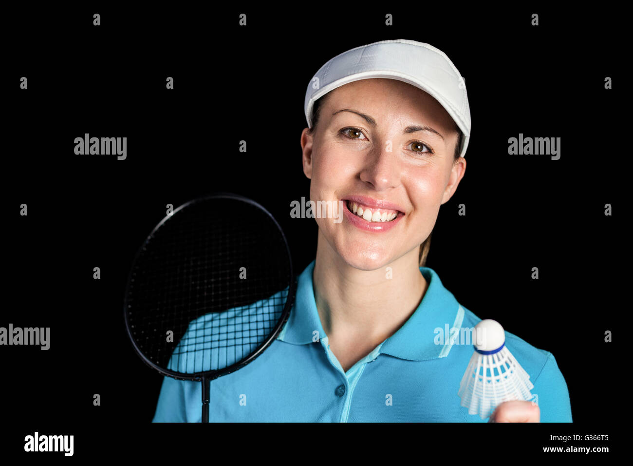Badminton player holding badminton racket and shuttlecock Stock Photo ...