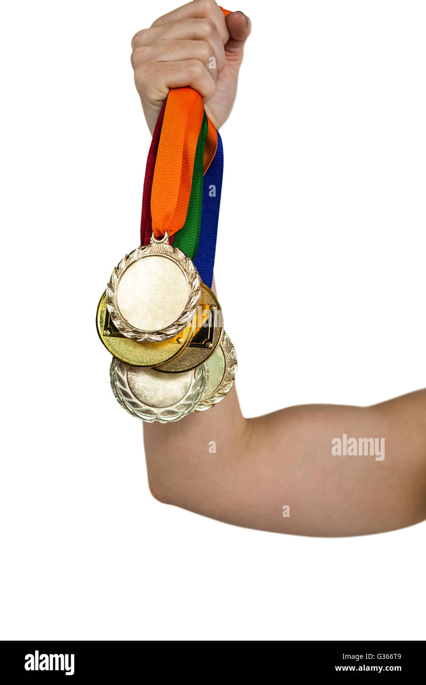 Athlete holding gold medals after victory Stock Photo - Alamy
