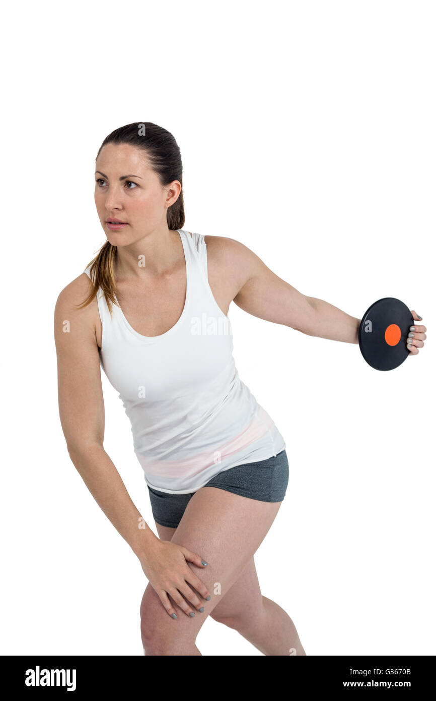 Female athlete playing discus throw on white background Stock Photo - Alamy