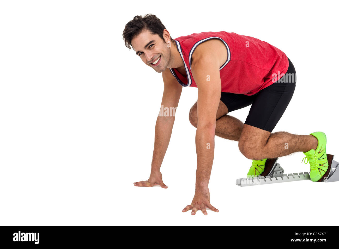 Portrait of male athlete in ready to run position Stock Photo - Alamy