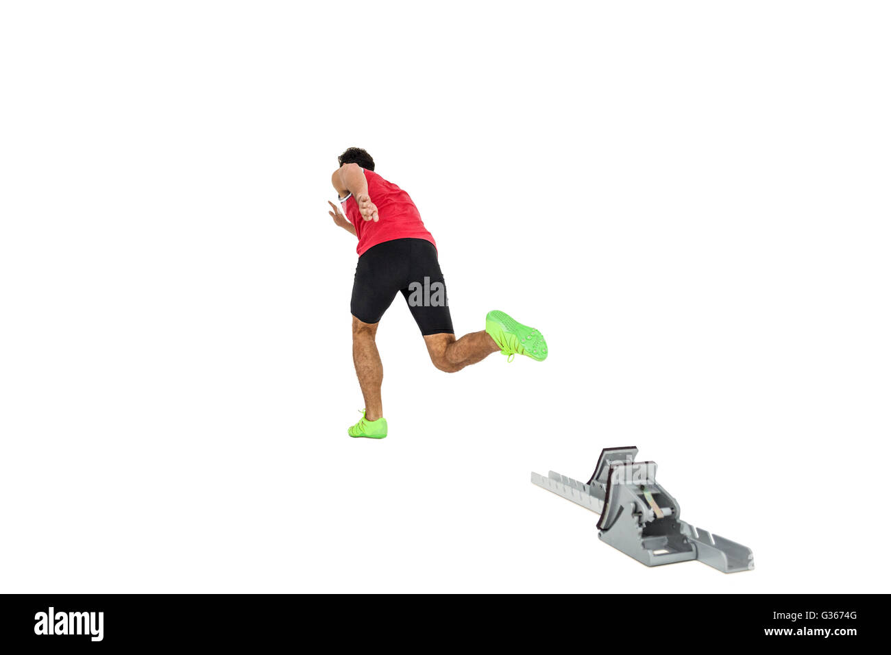 Male athlete running from starting blocks Stock Photo - Alamy