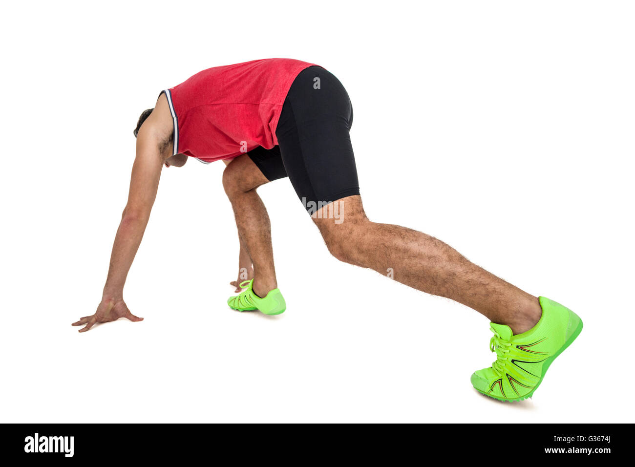Male athlete in ready to run position Stock Photo - Alamy