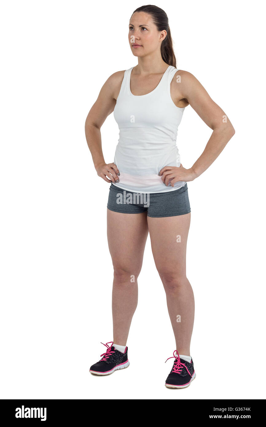 Athlete woman standing with hands on hips Stock Photo - Alamy
