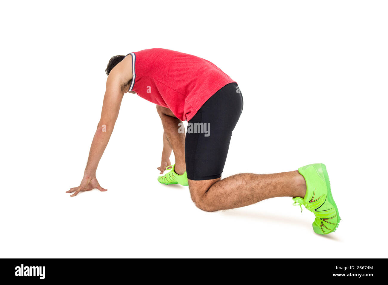 Male athlete in ready to run position Stock Photo - Alamy