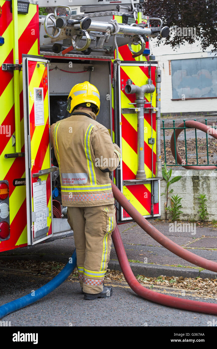 Dorset & Wiltshire Fire and Rescue fireman firefighter at scene of fire ...
