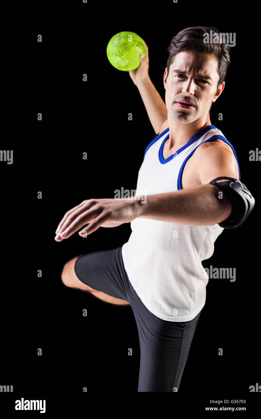 Portrait of athlete man throwing a ball Stock Photo - Alamy