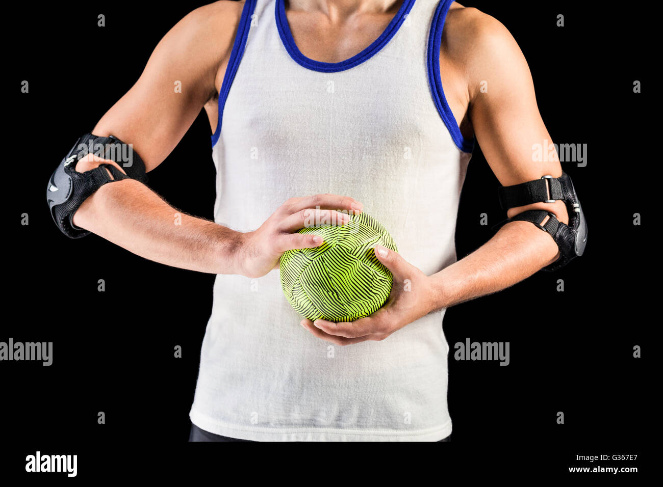Mid section of athlete man holding ball Stock Photo - Alamy