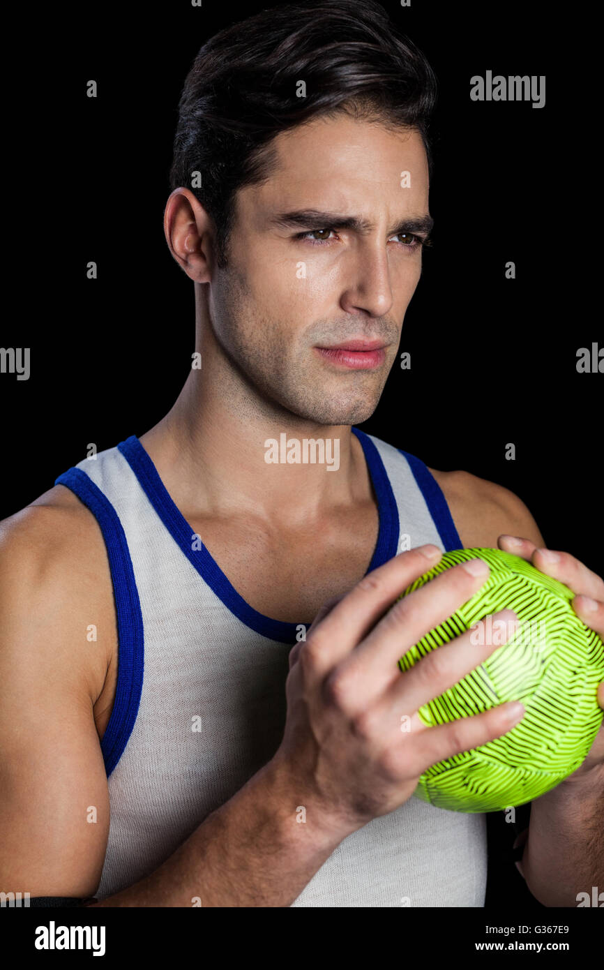Black man holding a ball hi-res stock photography and images - Alamy