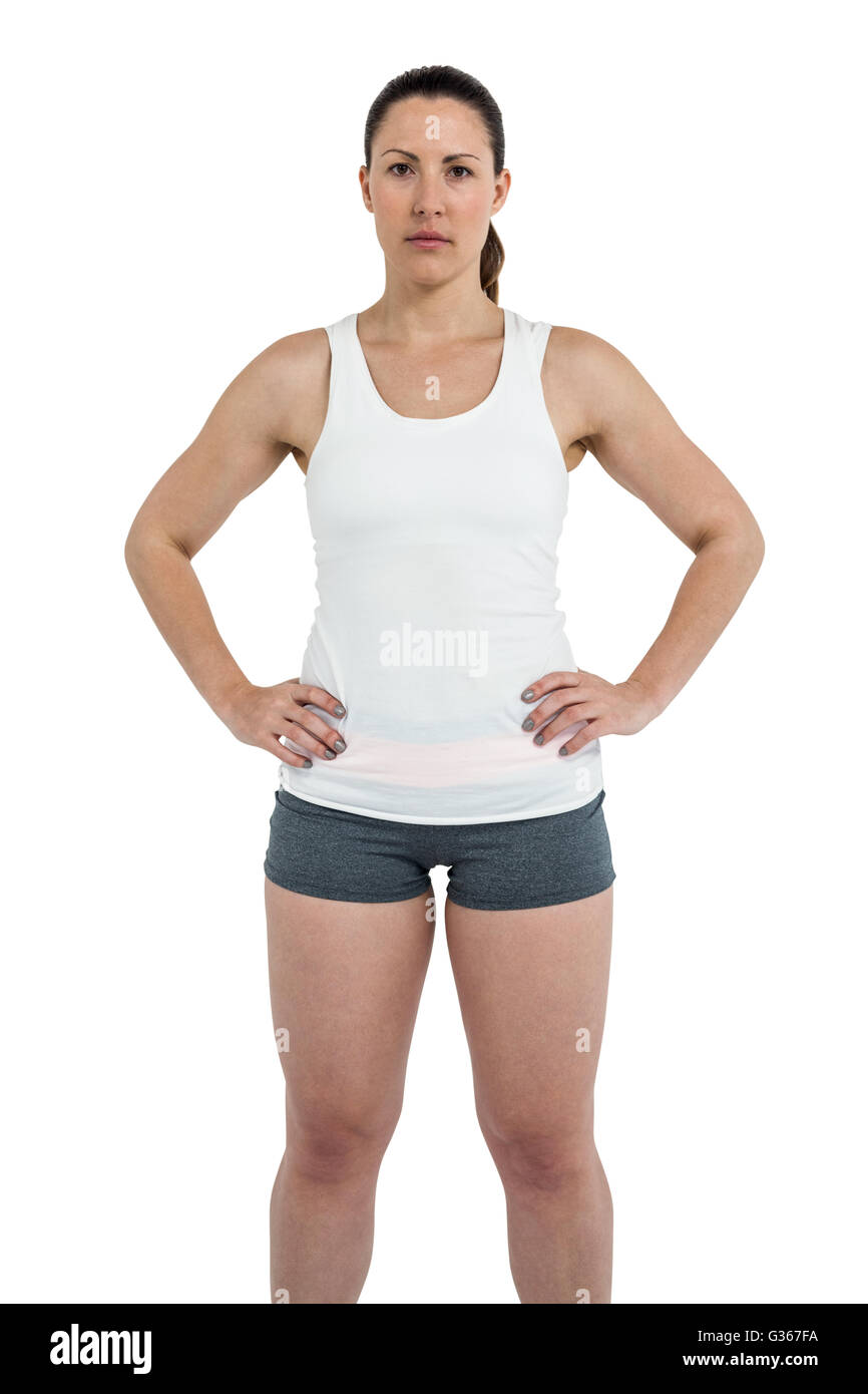 Portrait of female athlete standing with hands on hips Stock Photo - Alamy