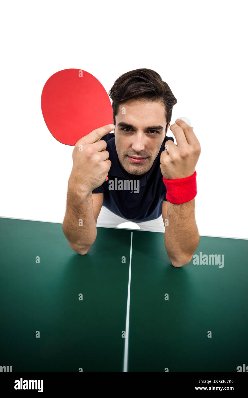 Confident male athlete leaning on hard table Stock Photo - Alamy