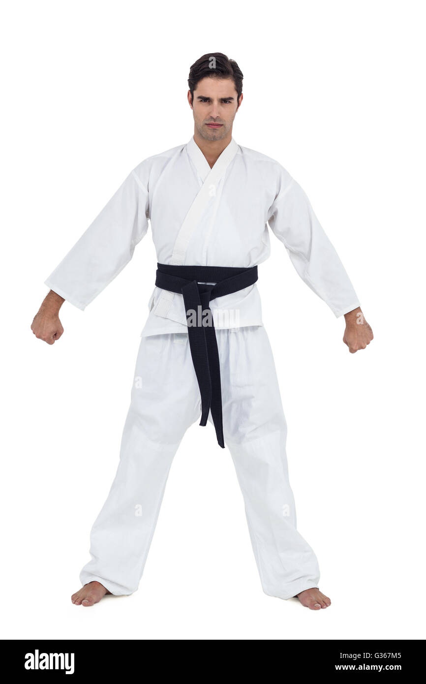 Male karate player posing on white background Stock Photo - Alamy