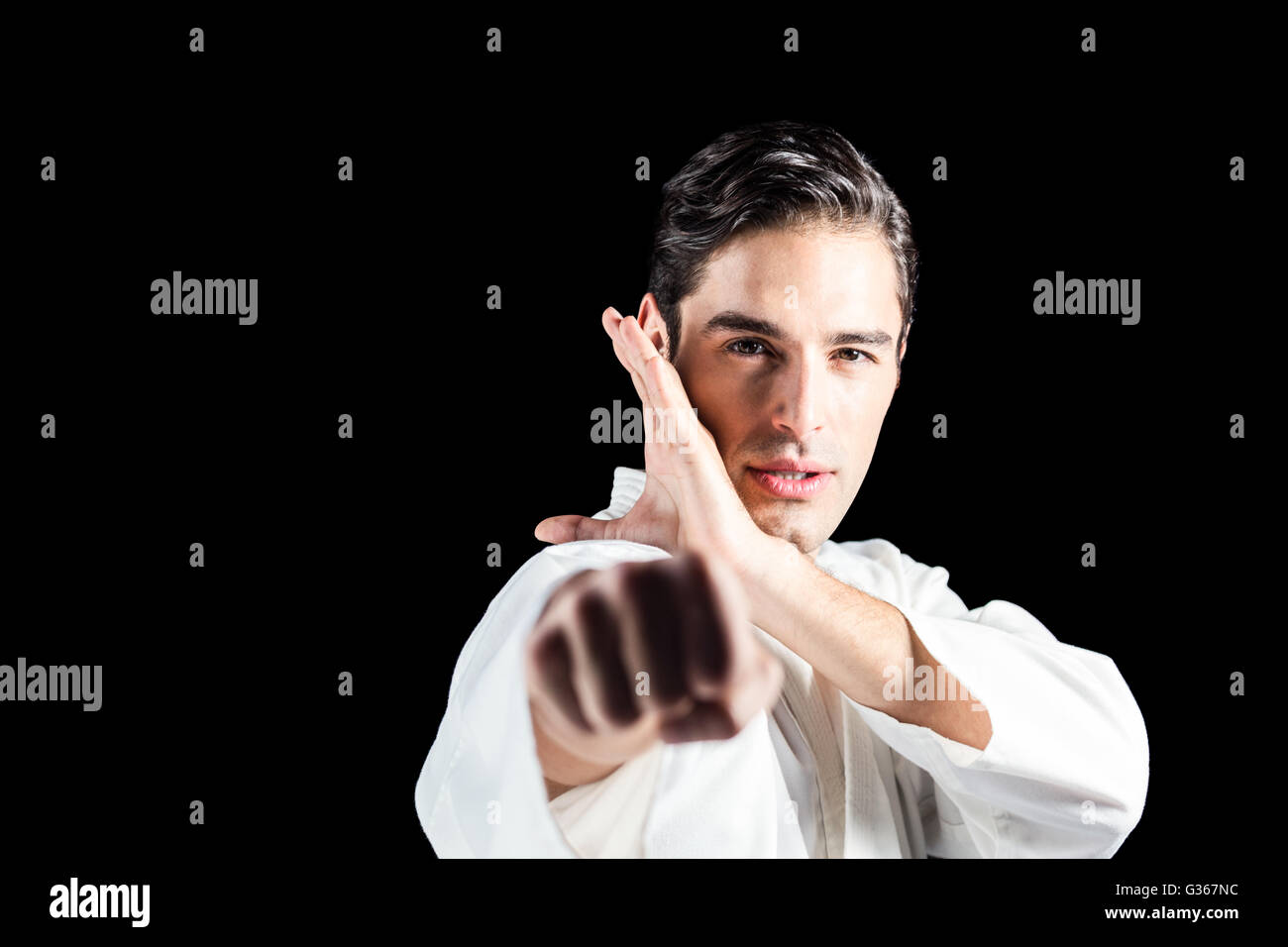 Portrait of fighter performing karate stance Stock Photo - Alamy